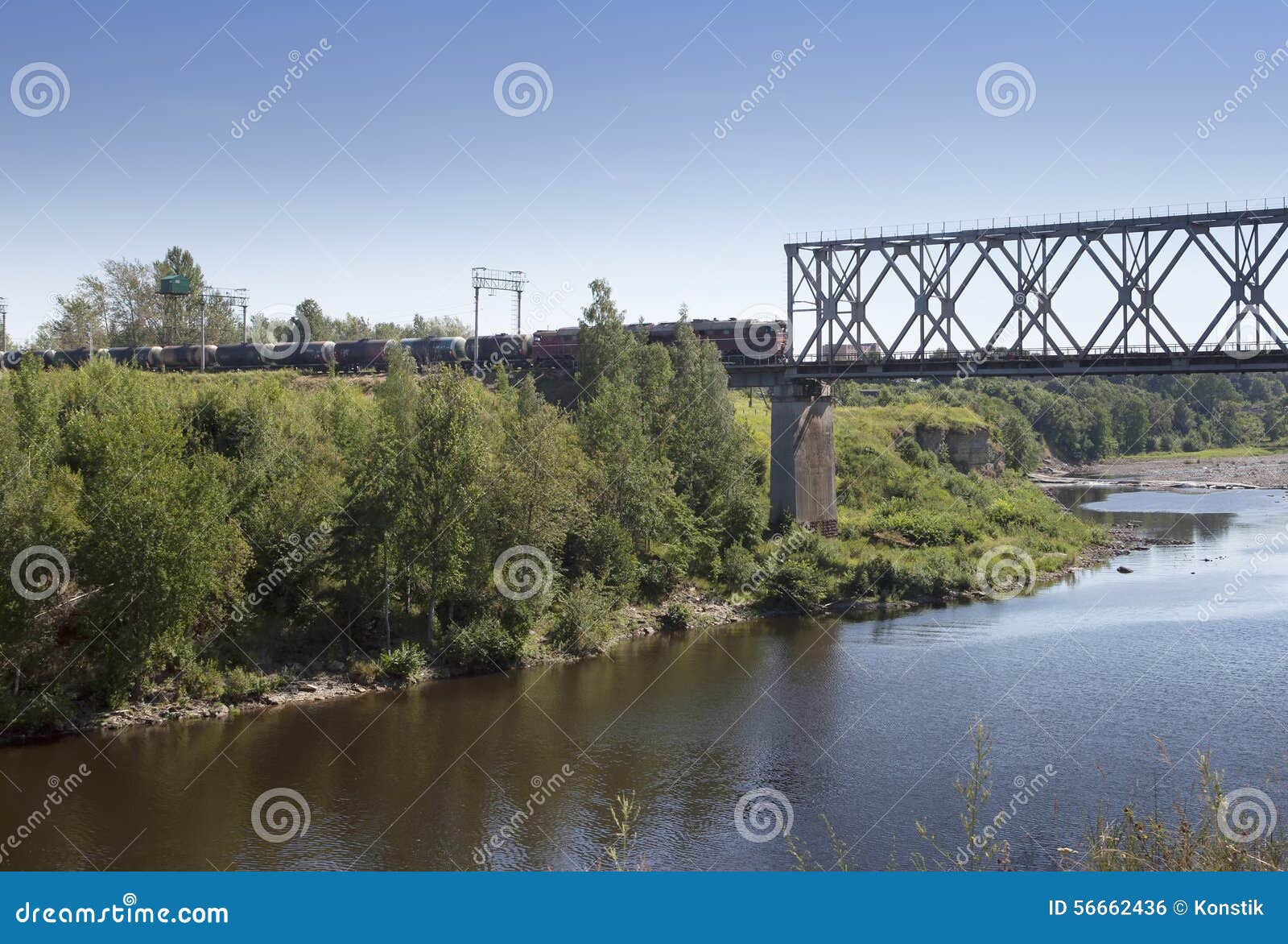 The Train Drives on the Bridge through the River Narva. Estonia. Stock ...
