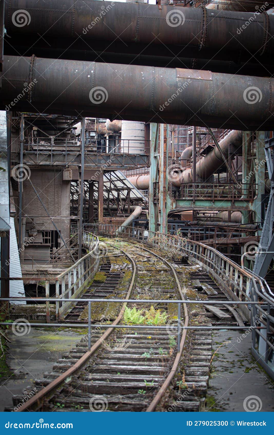 A Train Engine Tracks Passing through an Old Industrial Plant Area ...