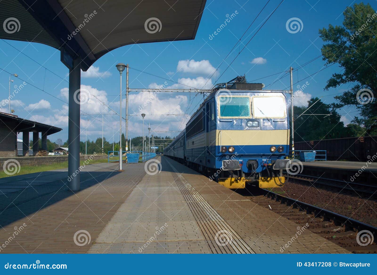 Train entering the station stock photo. Image of shadows - 43417208