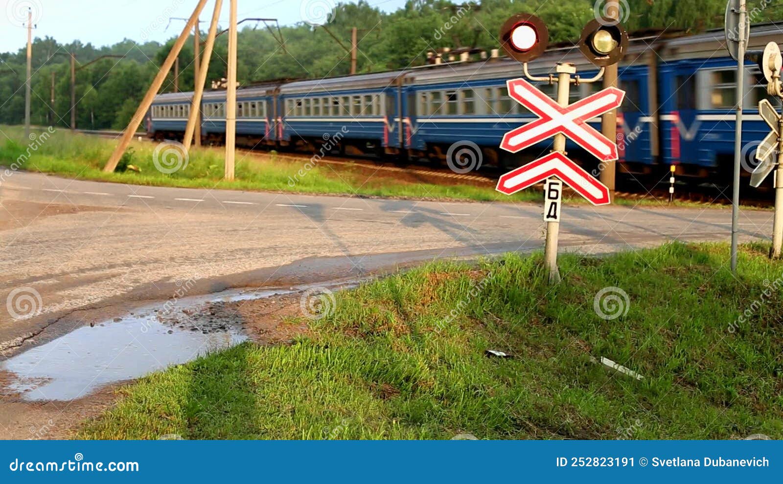 The Train Goes through the Railroad Crossing Stock Video - Video of ...