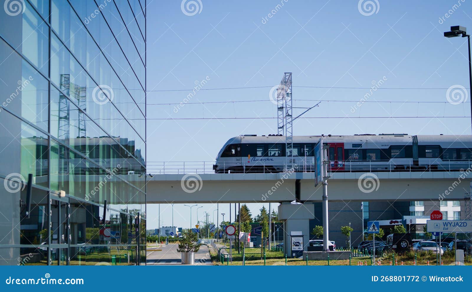 Train Going on Elevated Tracks in Front of a Glass Building in Gdansk ...