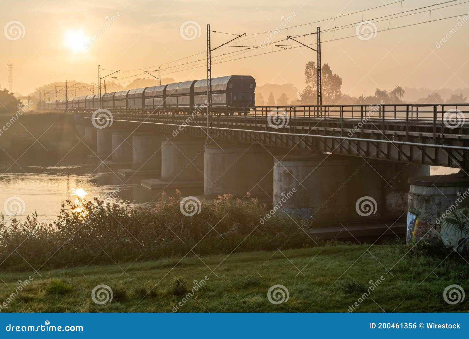 Train Going Over a Bridge at Sunrise Stock Photo - Image of traffic ...