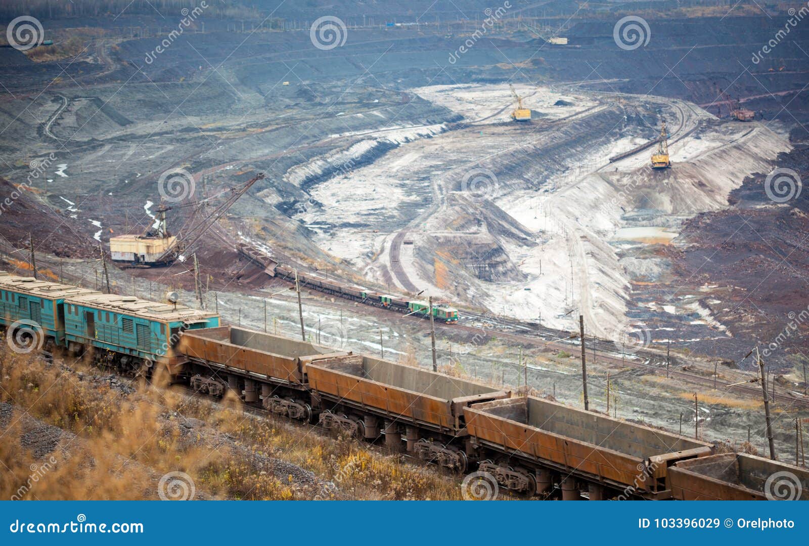 Train at the Iron Ore Opencast Mine is Going for Loading Iron Stock ...