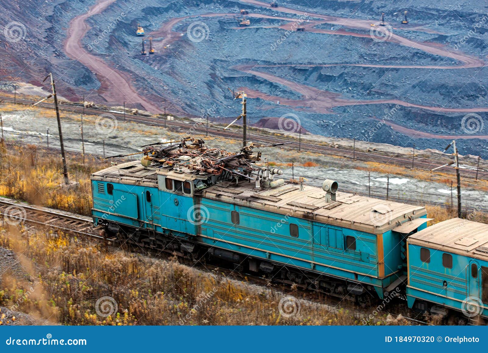 Train at the Iron Ore Opencast Mine is Going for Loading Iron Ore Stock ...