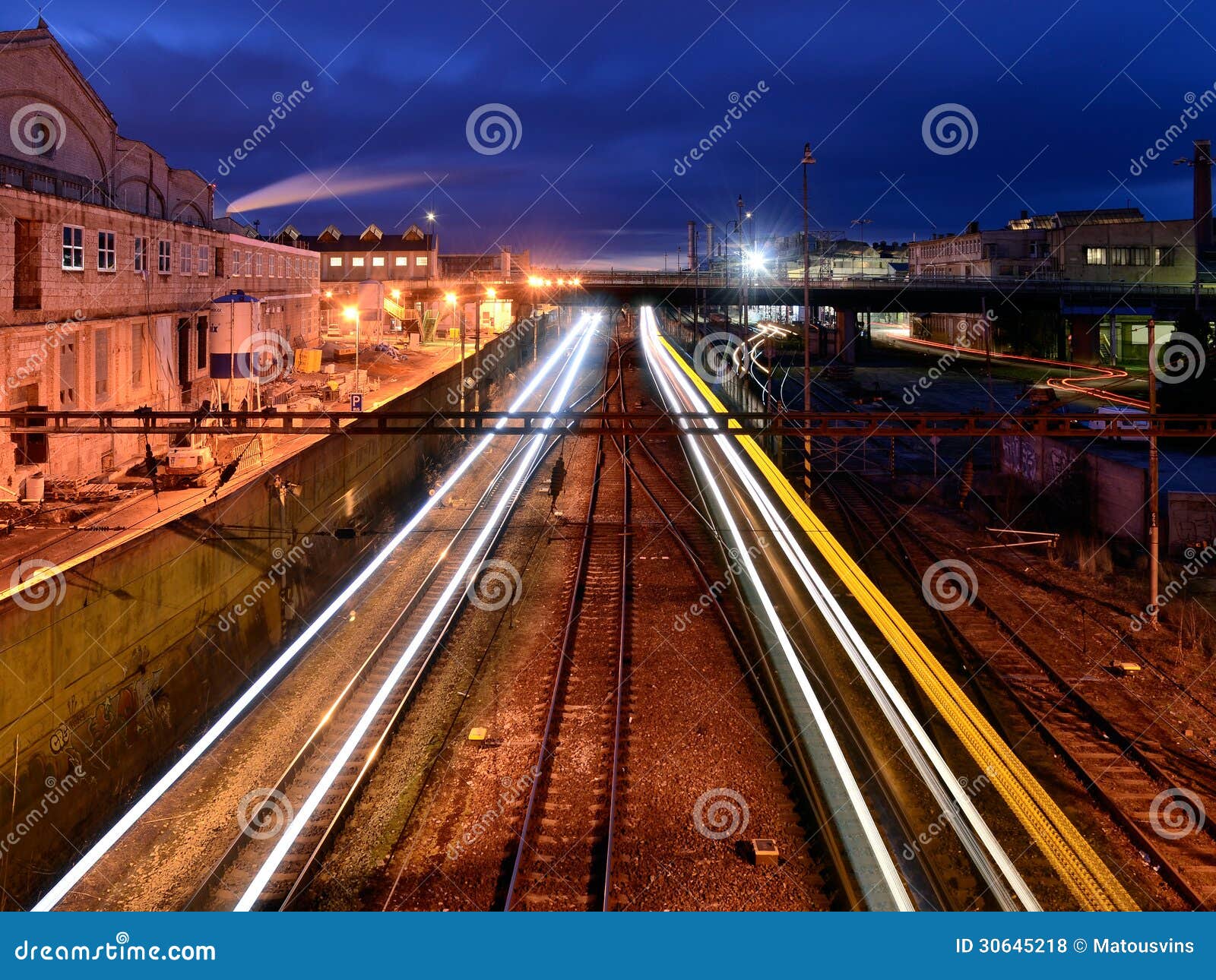 Train Light Lines in an Industrial Area Stock Photo - Image of movement ...