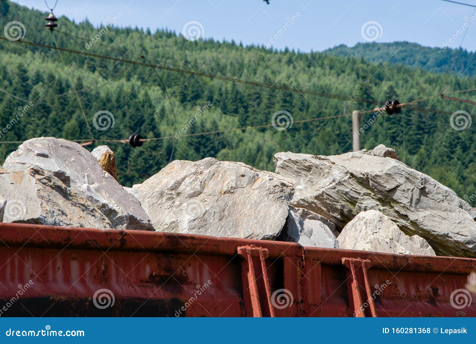 The Train is Loaded with Huge Chunks of Granite, Cargo Platform with ...