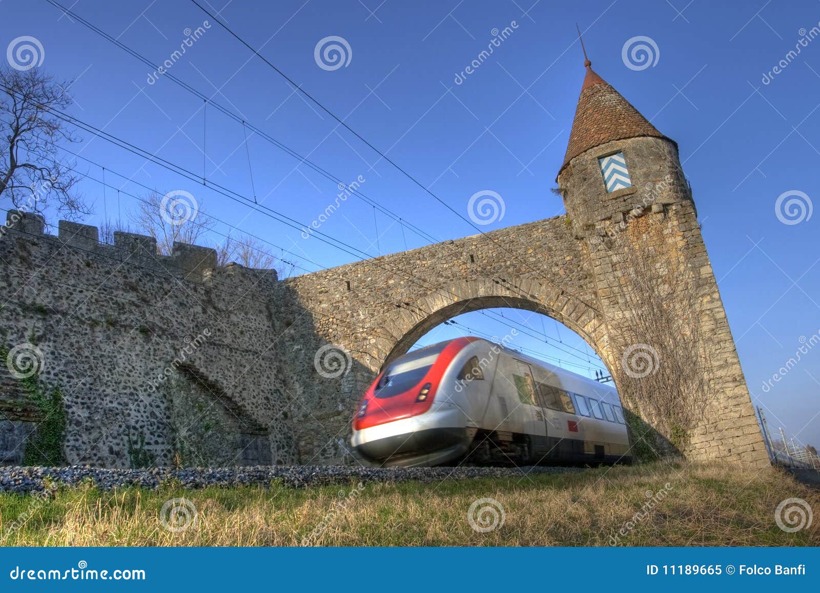 Train through Medieval Gate Stock Image - Image of modern, speed: 11189665