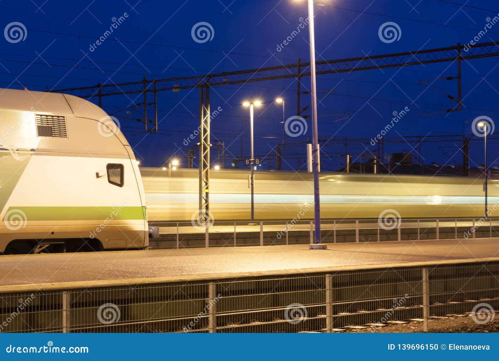 Train in Motion on the Station at Night, Long Exposure Photo Stock ...