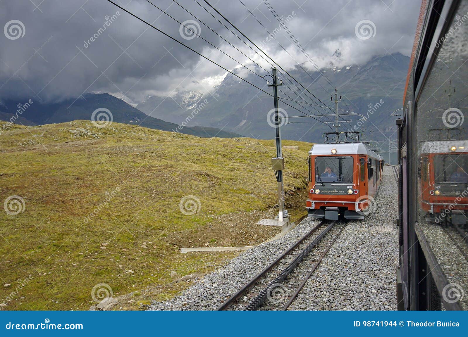 Train in Motion and the Swiss Alps Mountains in Background Editorial ...
