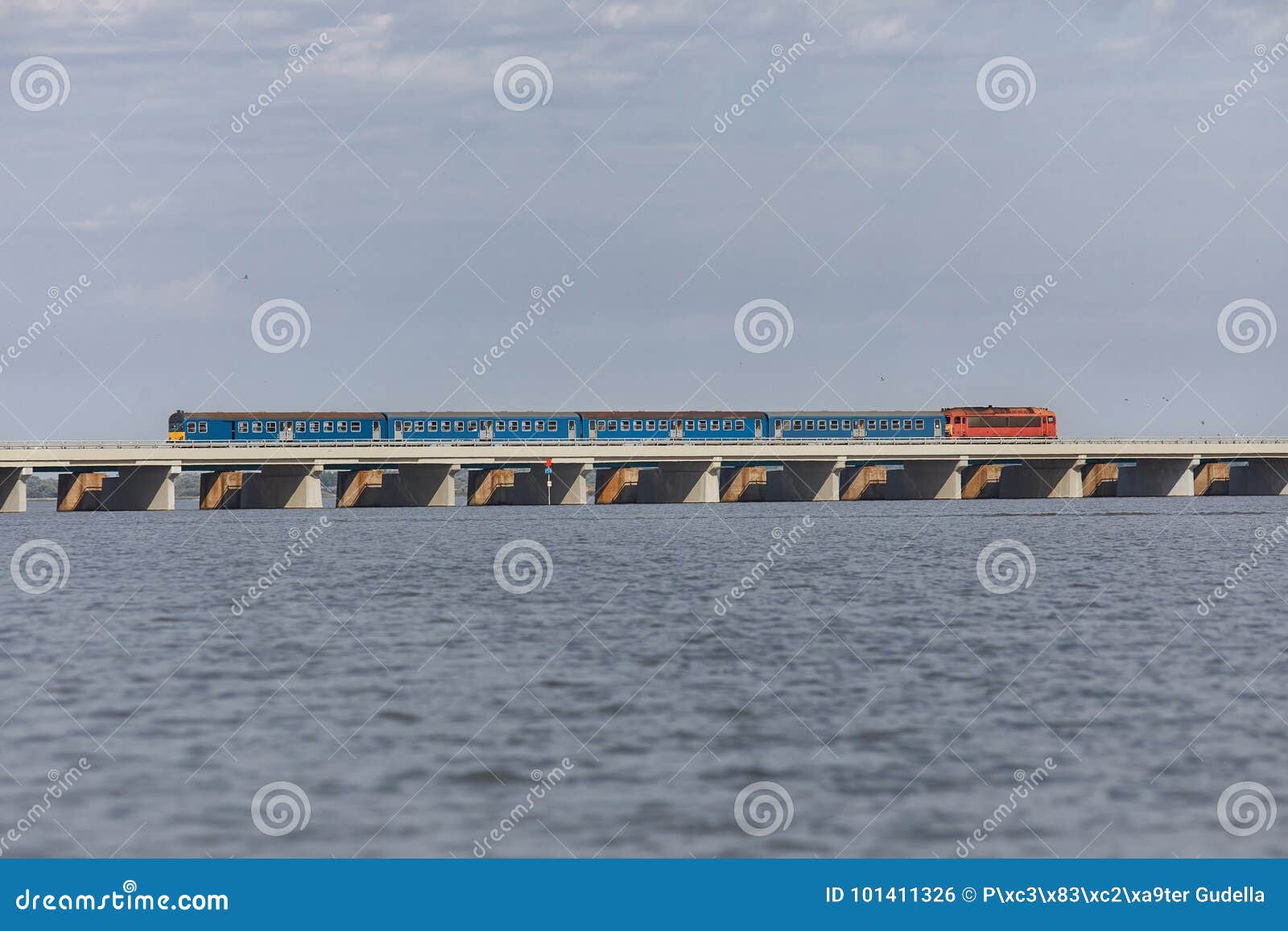 Train over a lake stock photo. Image of diesel, pass - 101411326