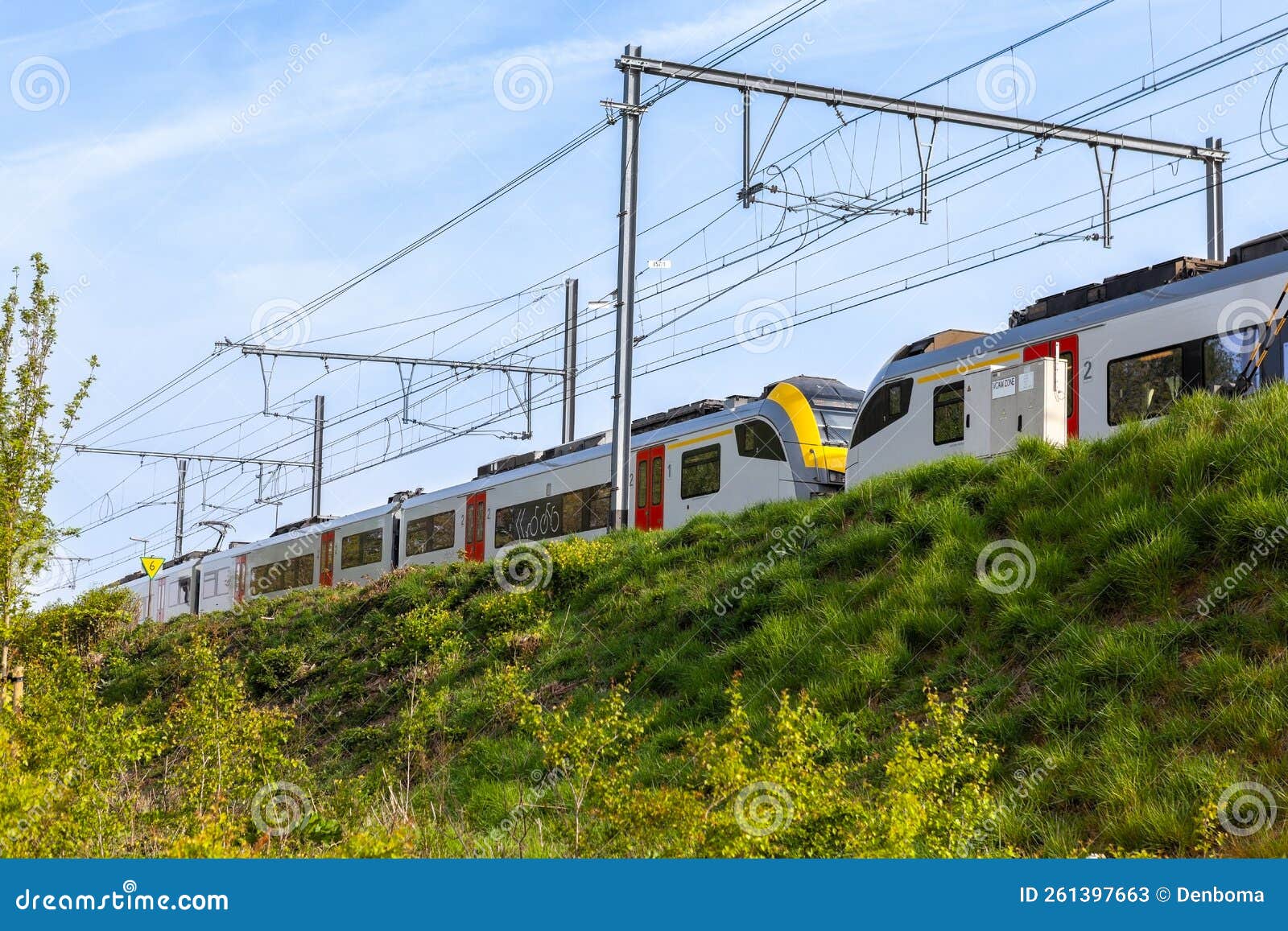 Train over raised berm stock image. Image of travel - 261397663