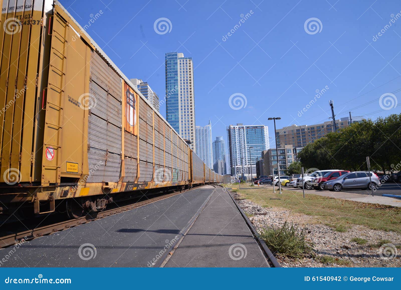 Train Passing with Downtown in the Background Editorial Photography ...