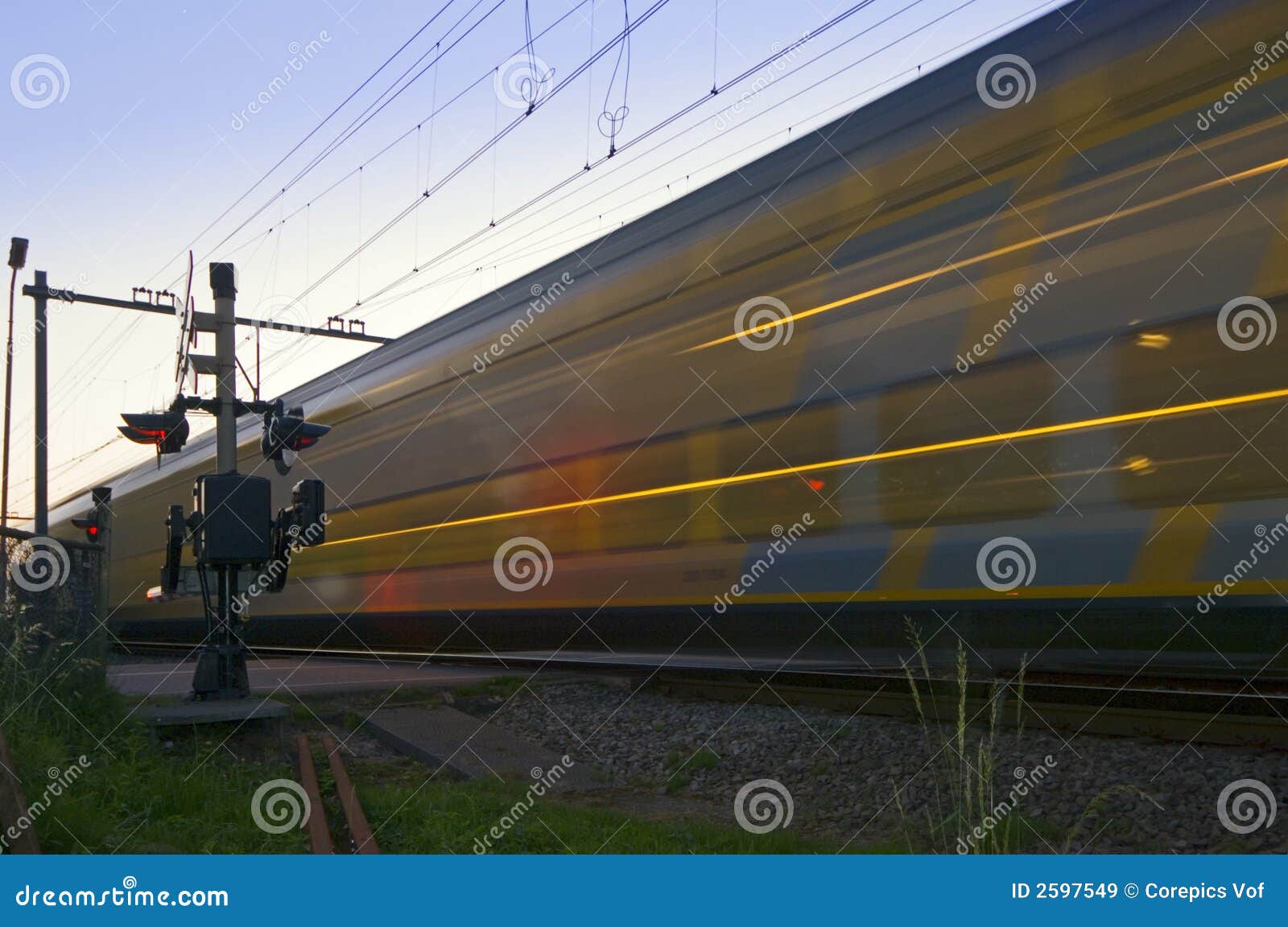 A Train Passing at High Speed Stock Image - Image of undergrowth, blue ...