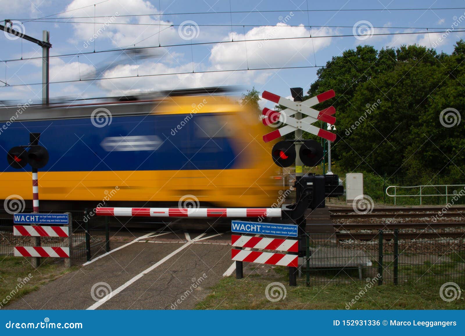 Train Passing a Level Crossing with High Speed Stock Photo - Image of ... Train Passing a Level Crossing with High Speed Stock Photo - Image of ...
