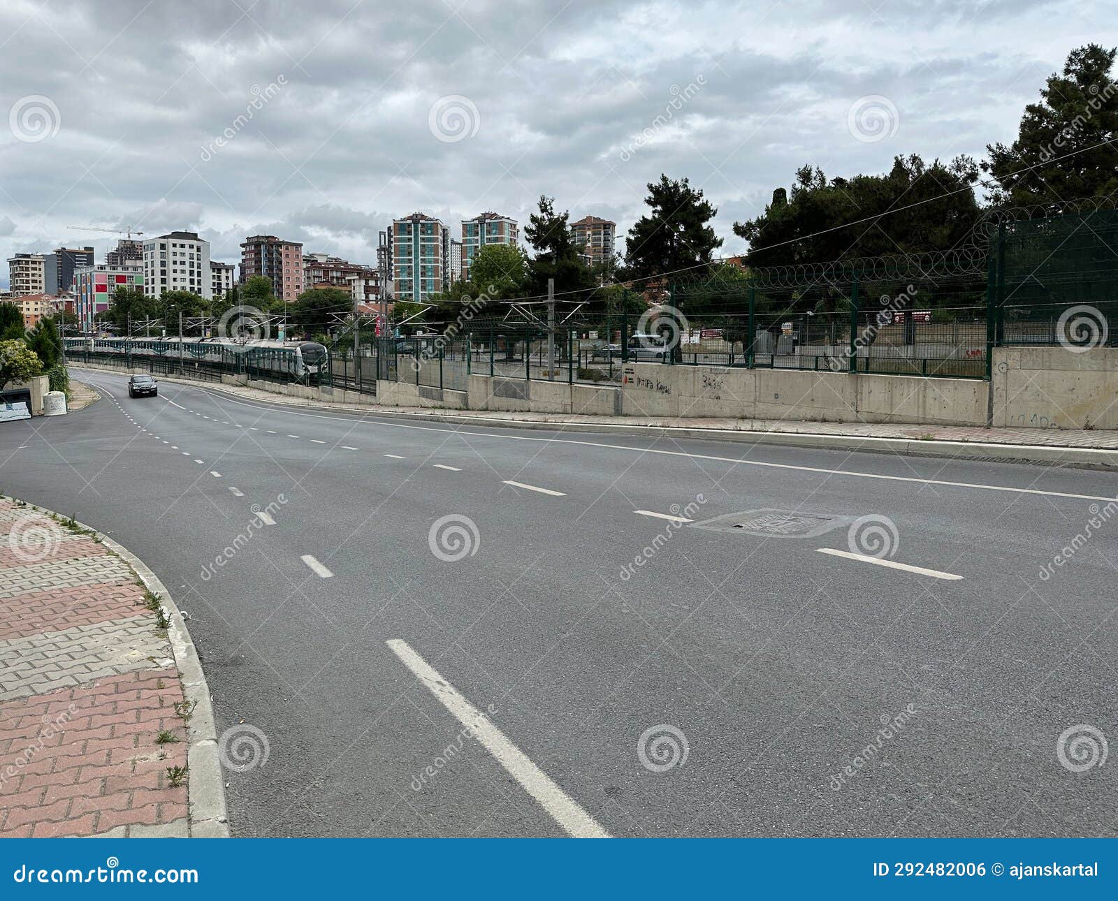 A Train is Passing on the Railway Track Which Run Parallel To the Road ...