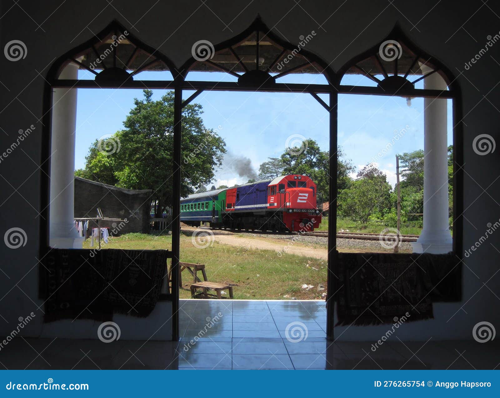Train Passing through the Window of a Small Mosque Stock Photo - Image ...