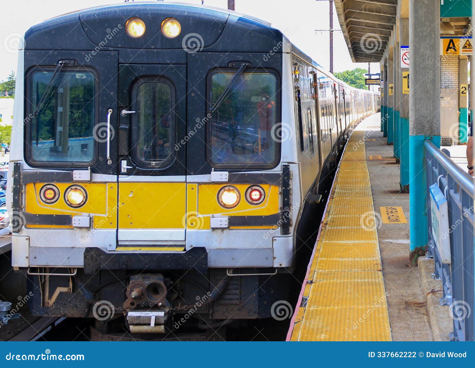 A Train Pulling into an Eleveted Train Station Stock Photo - Image of ...