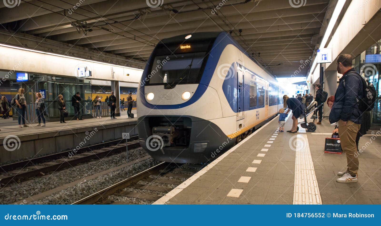 Train Pulling Onto a Platform at a Covered Railway Station with ...