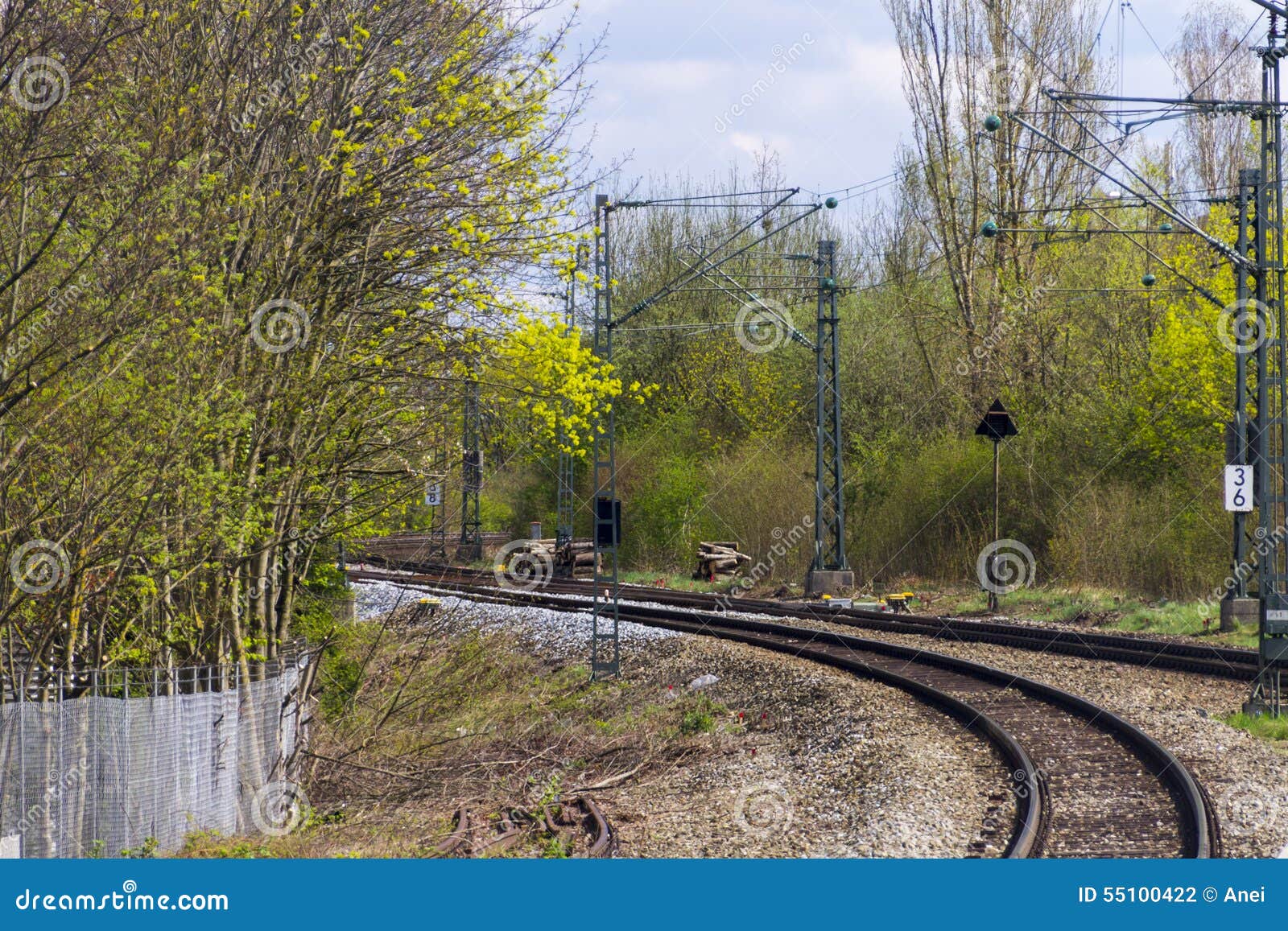 Train Rails Turning Left Behind a Corner Stock Photo - Image of summer ...