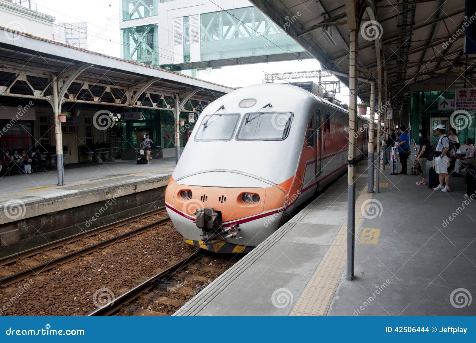 A Train Of Taiwan High Speed Rail (THSR) Traveling Through A Railway ...