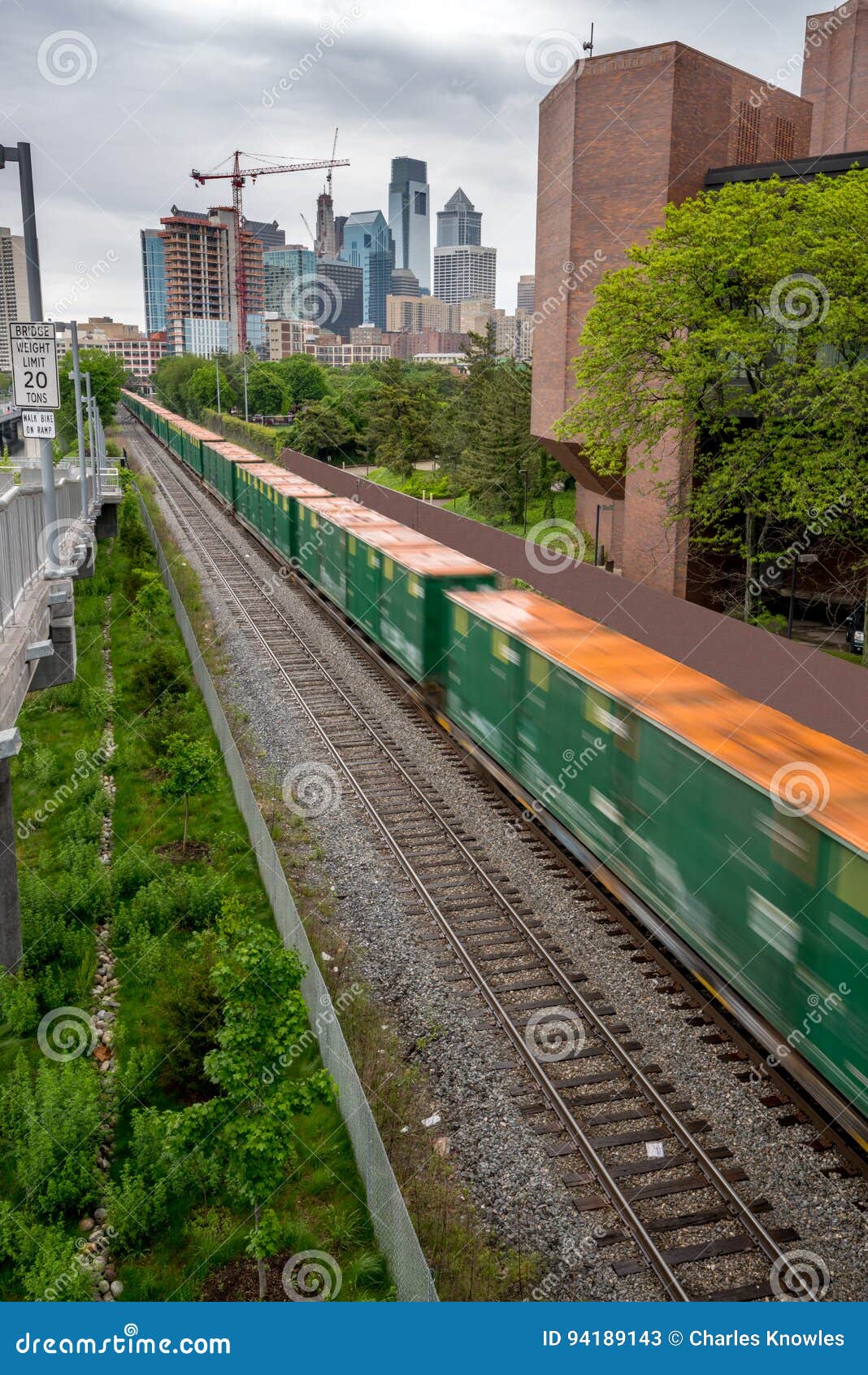 Train Rolls Down the Tracks with Philadelphia Skyline Stock Image ...