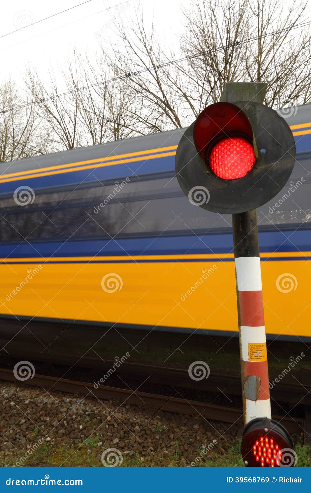 Train Rushing Past Railway Crossing Stock Image - Image of warning ...
