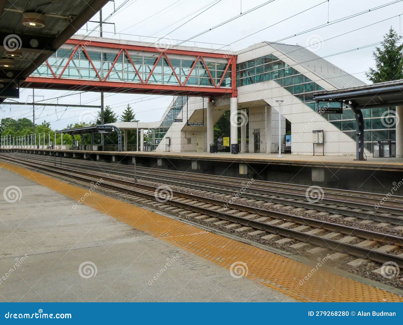 Train Station with Bridge Over the Train Tracks Editorial Image - Image ...