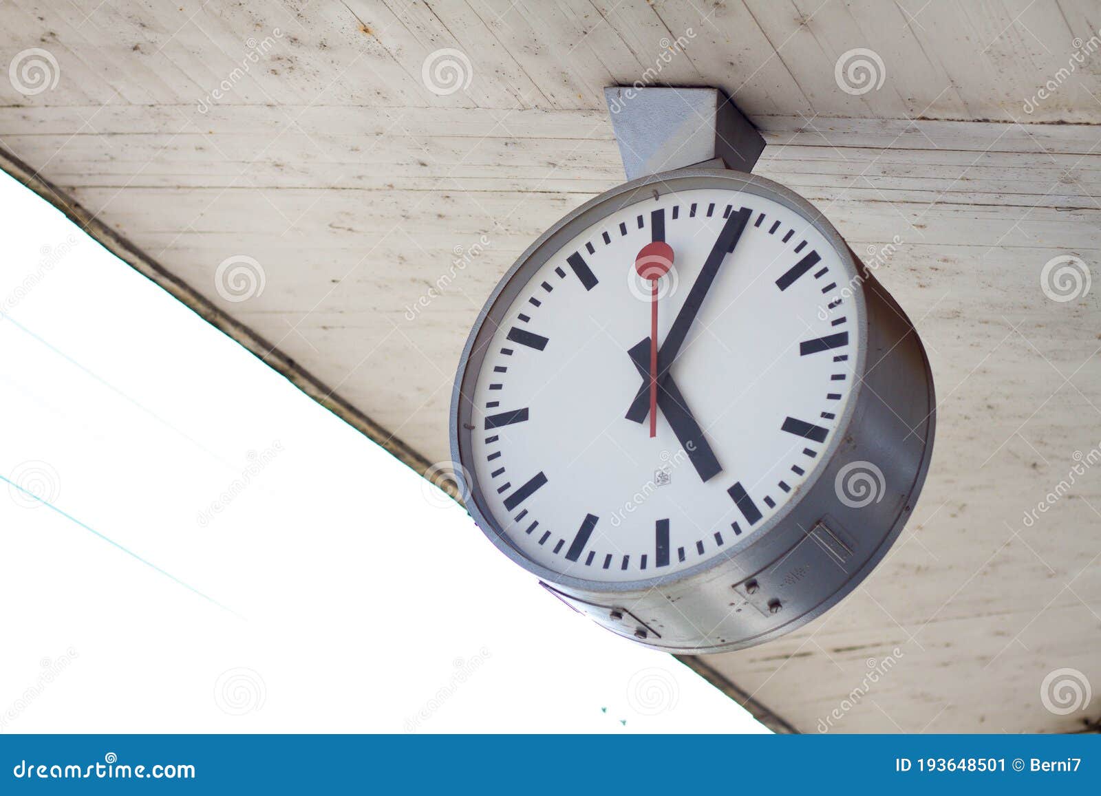 Train Station Clock on the Platform with Railroad Tracks in the ...