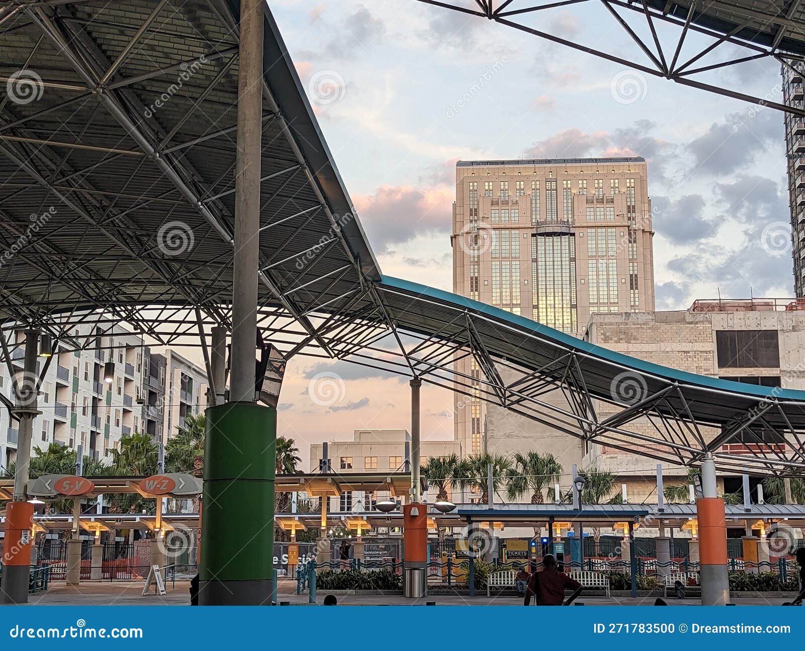 Train Station in Front of Skyscraper in Evening Stock Photo - Image of ...