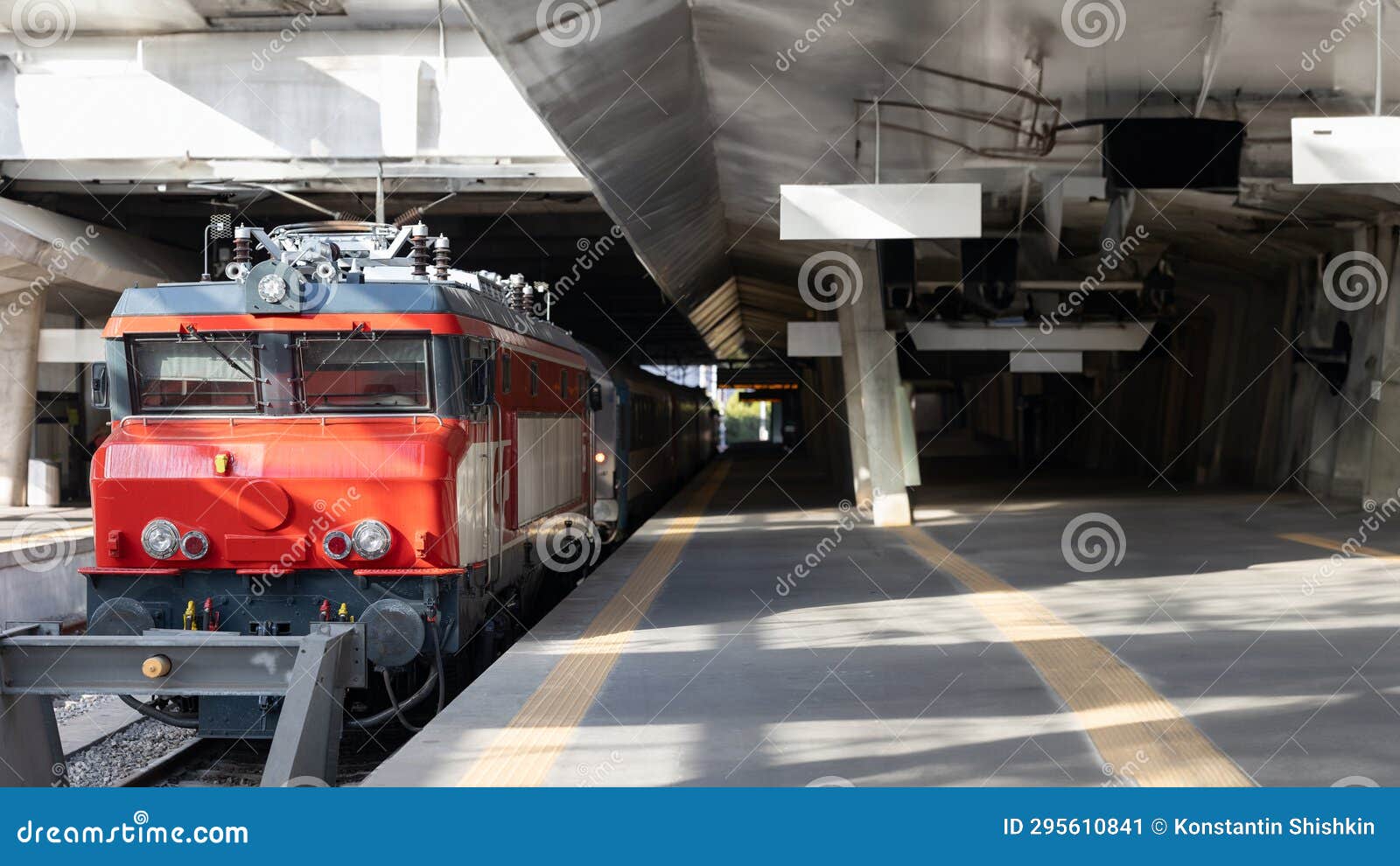 A Train Station with Various Levels and a Red Train. Stock Image ...