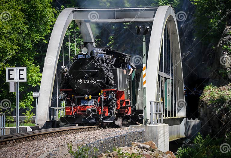 Train with a Steam Engine Going Over a Bridge Stock Image - Image of ...