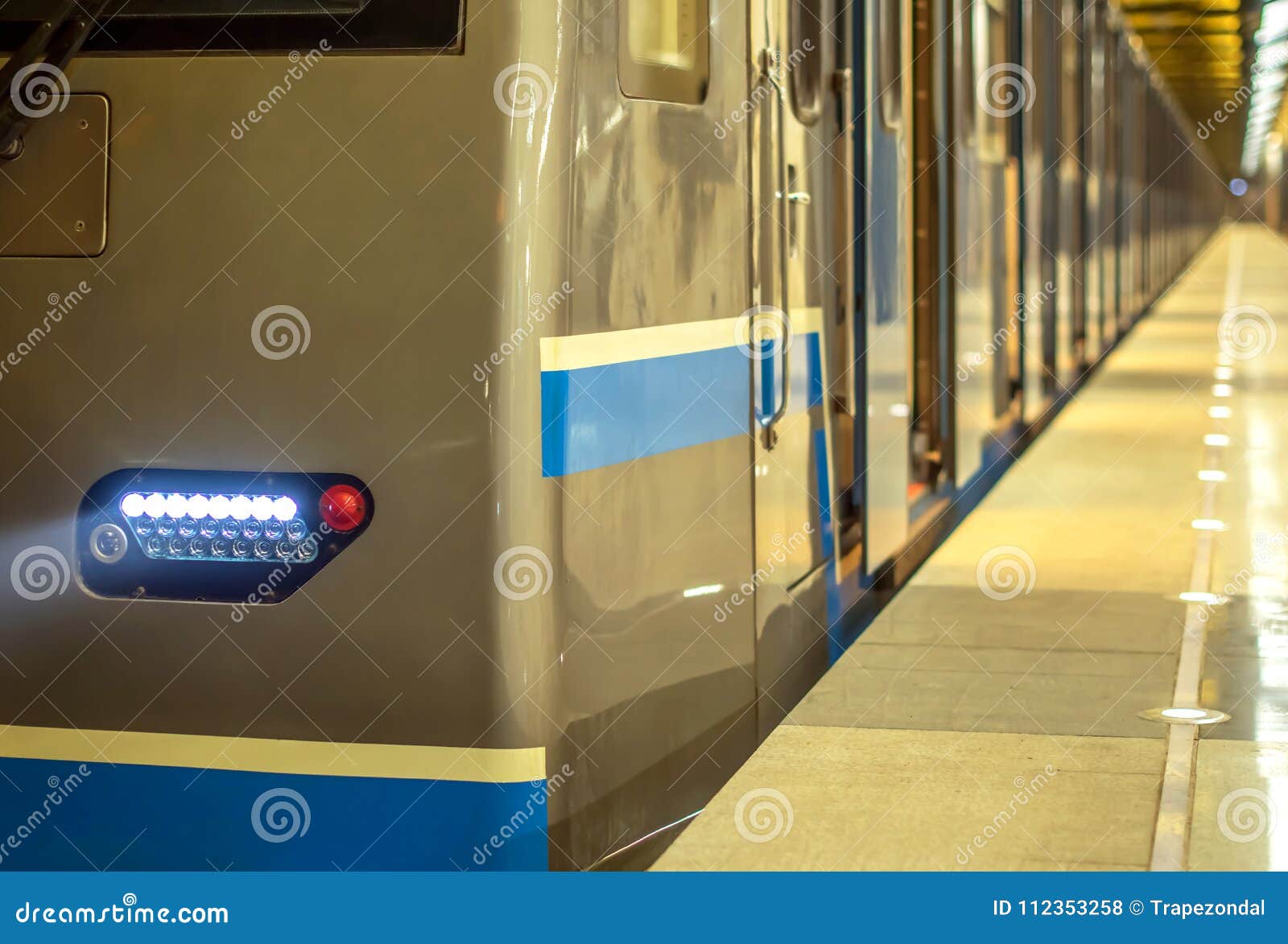 Train Stopped at the Metro Station Platform with Lights on Stock Photo ...