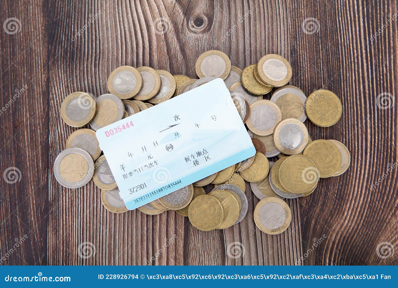 Train Ticket on a Pile of Coins Stock Photo - Image of china ...