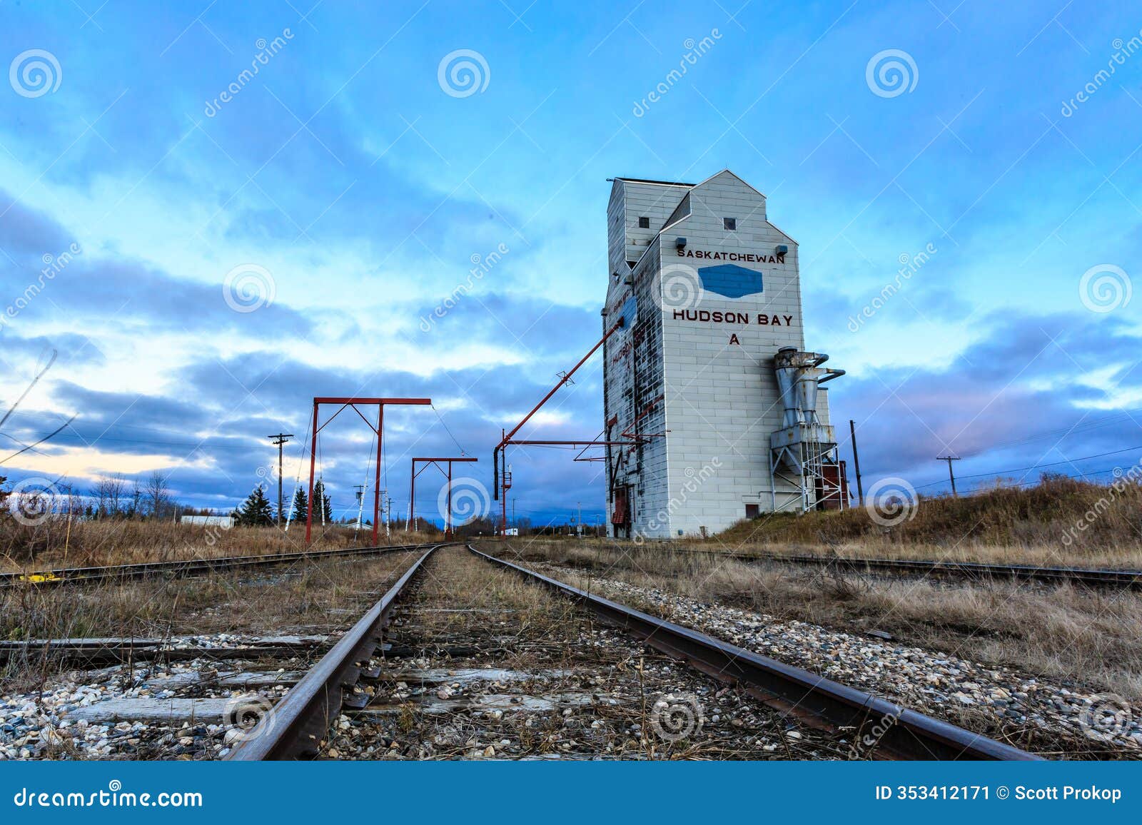 A Train Track with a Grain Silo in the Background Stock Image - Image ...