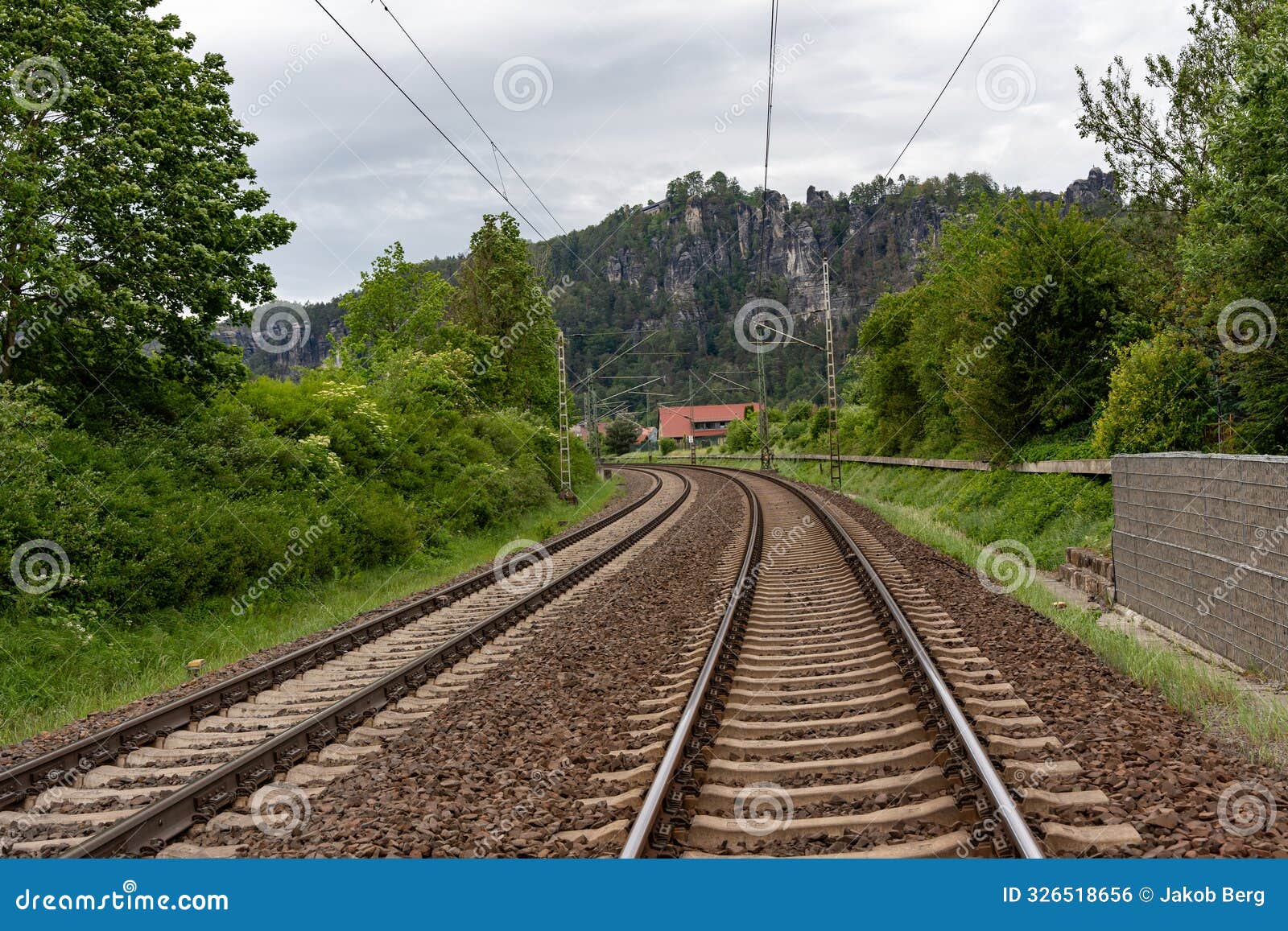 A Train Track with a Mountain in the Background Stock Photo - Image of ...