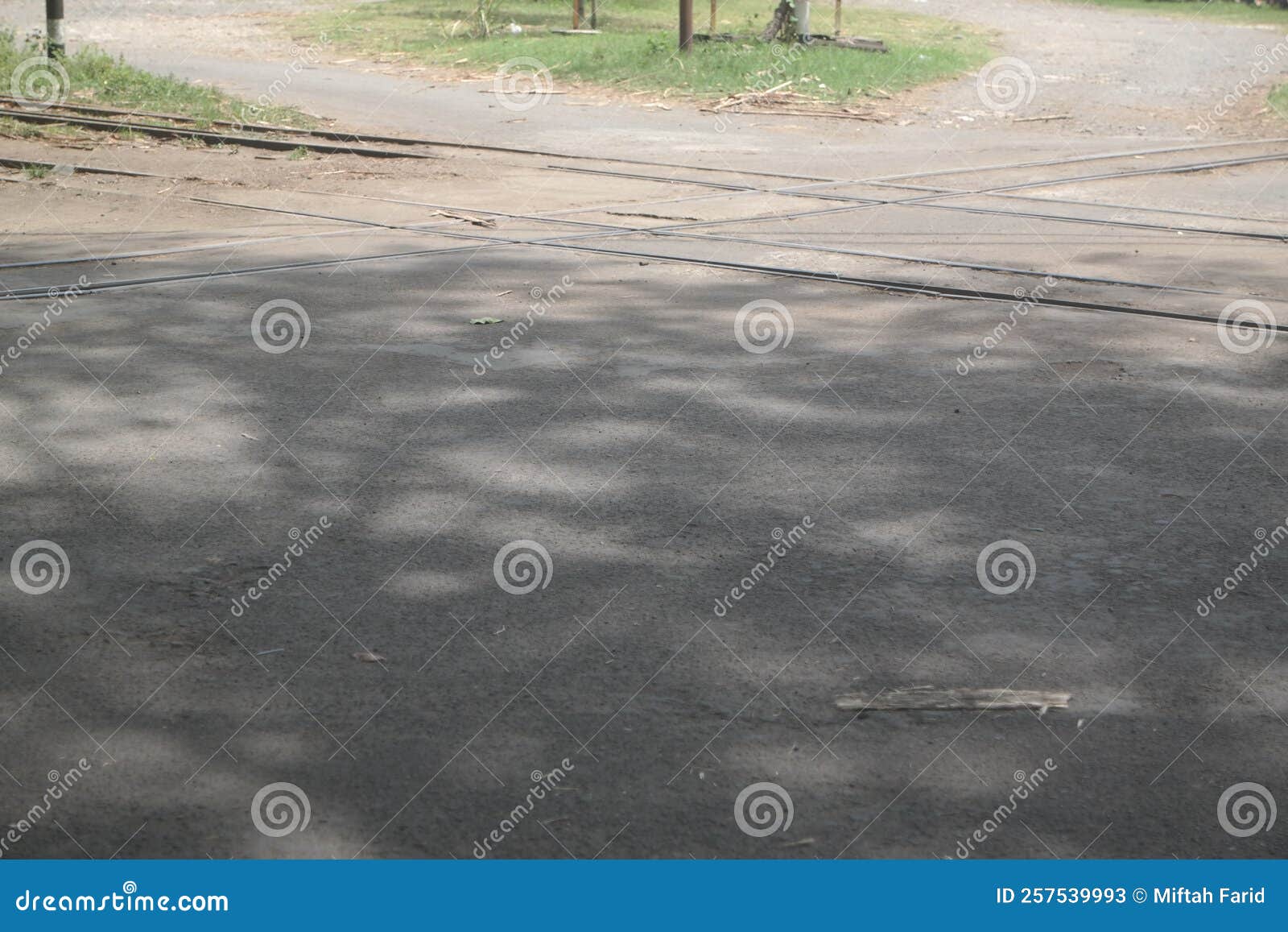 The Train Tracks on the Asphalt Road Stock Image - Image of sidewalk ...