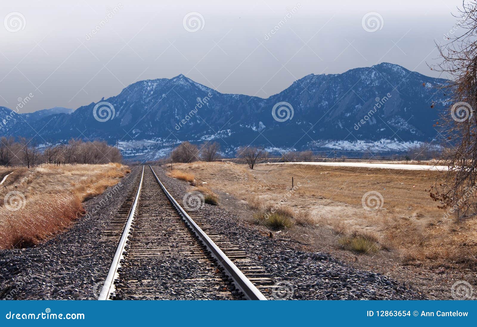 Train Tracks Head Towards Stormy Mountains Stock Photo - Image of ...