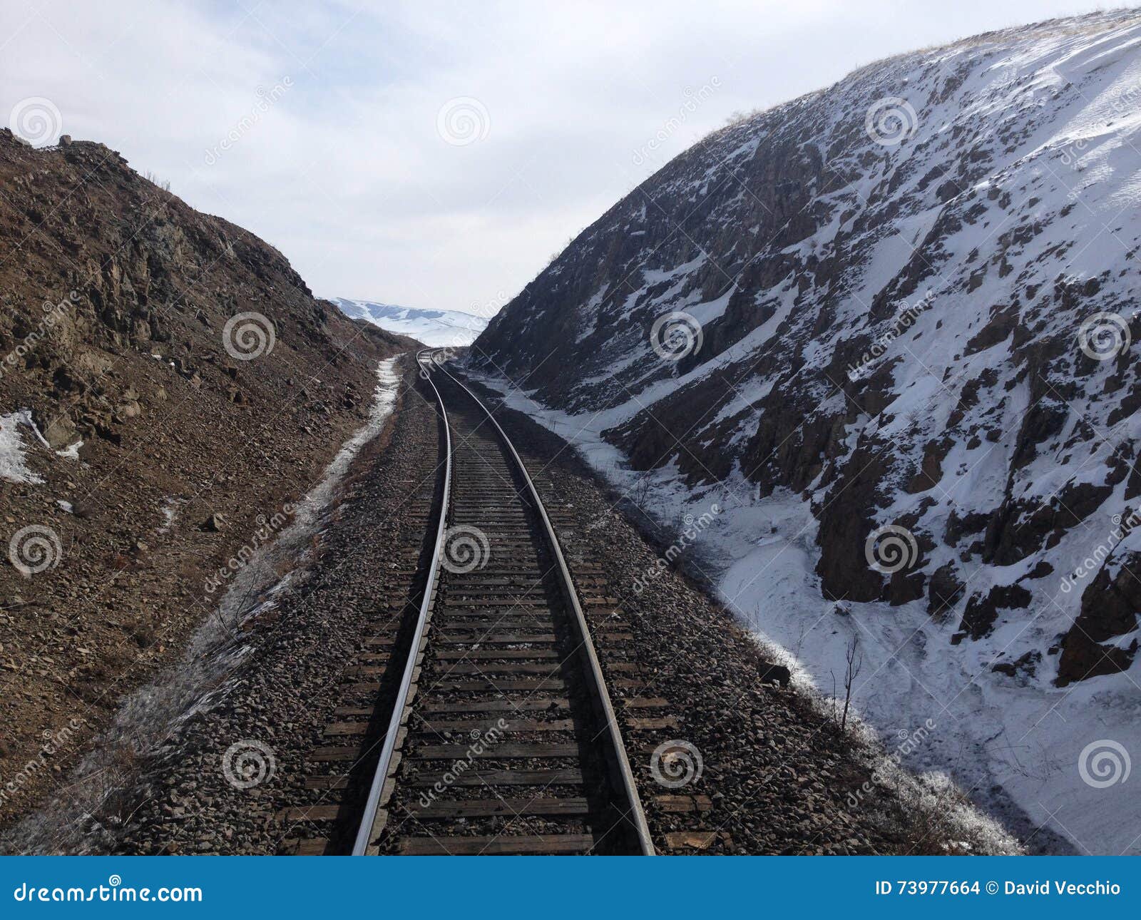 Train Tracks on Snowy Mountains Stock Photo - Image of winter ...