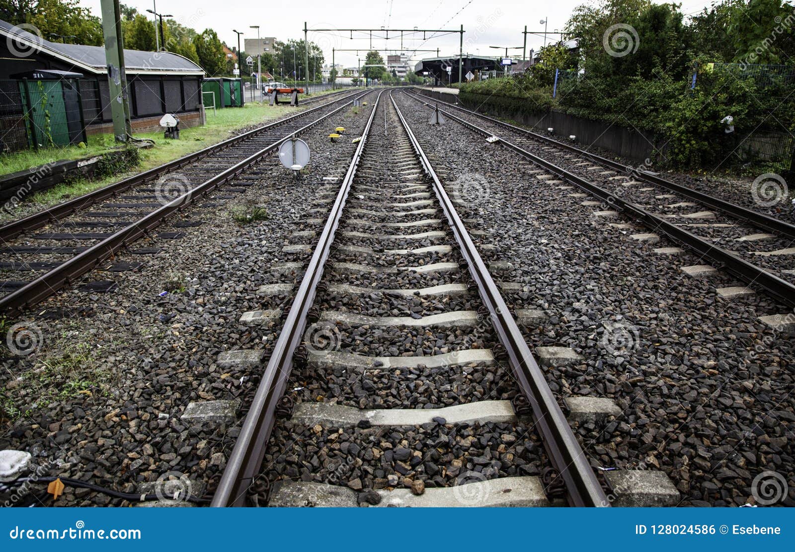 Train tracks in a station stock photo. Image of light - 128024586