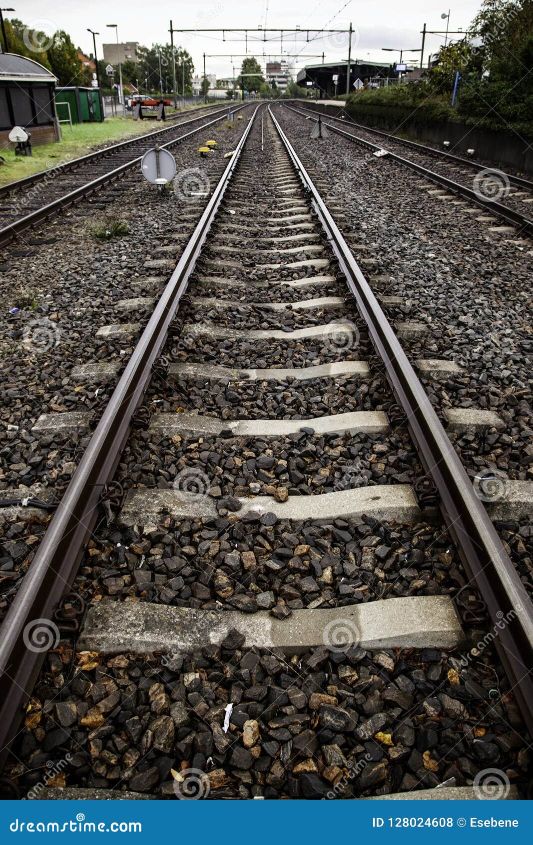 Train tracks in a station stock photo. Image of orange - 128024608