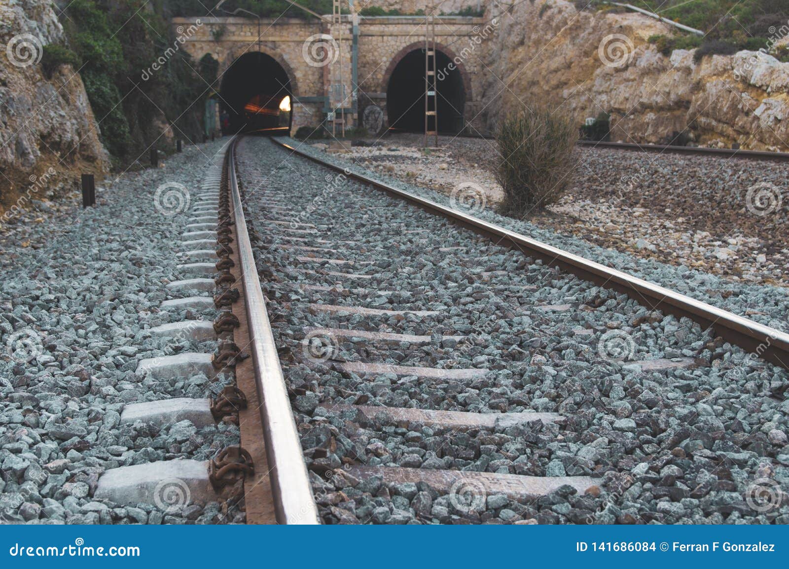 Train Tracks and Tunnel Background with Light Reflections Stock Photo ...