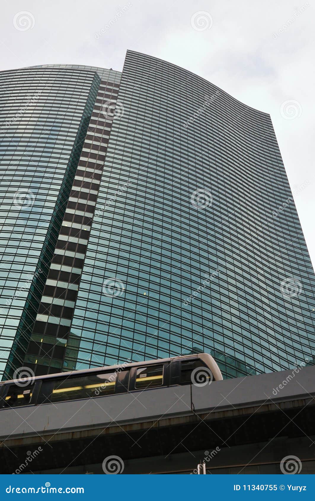 Train under skyscrapers stock image. Image of motion - 11340755