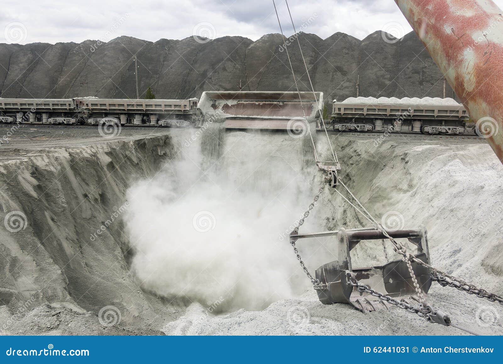 A train unloads ore stock image. Image of pollution, bucket - 62441031