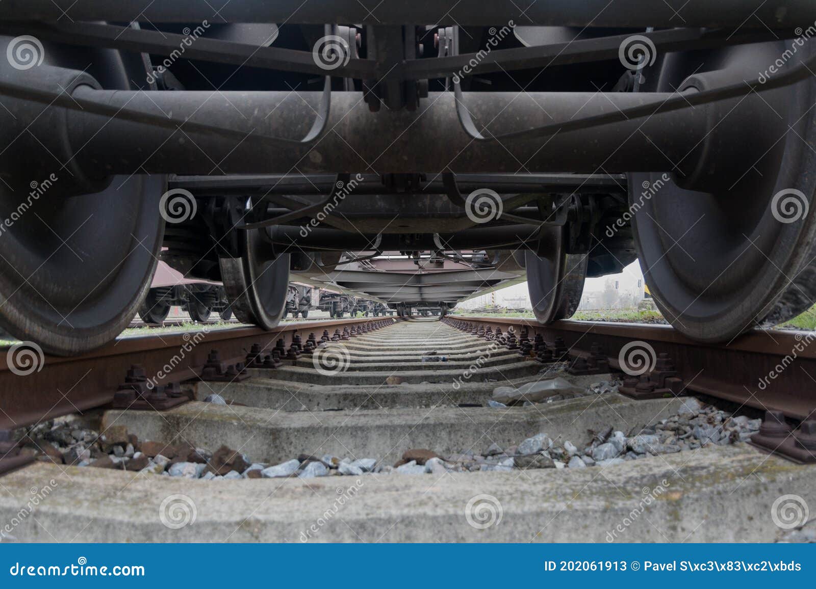 Train Wheels from Below from the Tracks Stock Image - Image of railroad ...