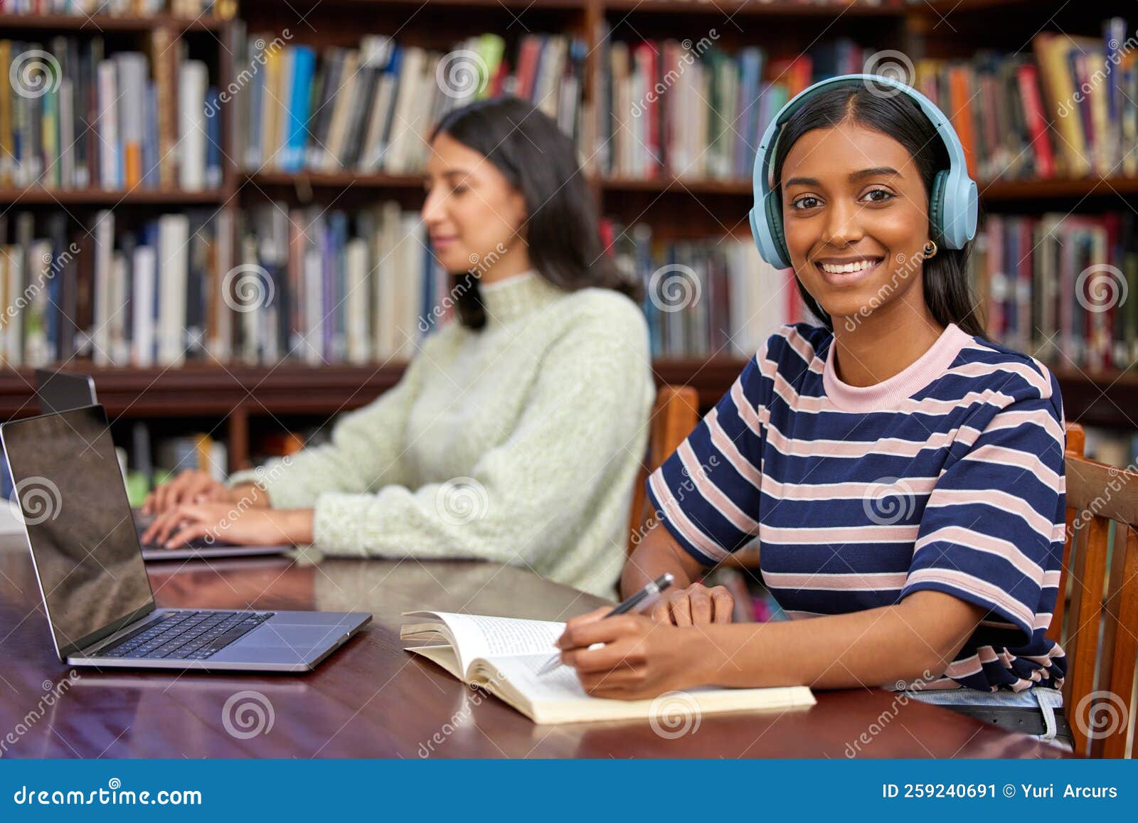 A Trained Librarian is a Powerful Search Engine. Two Students Studying ...