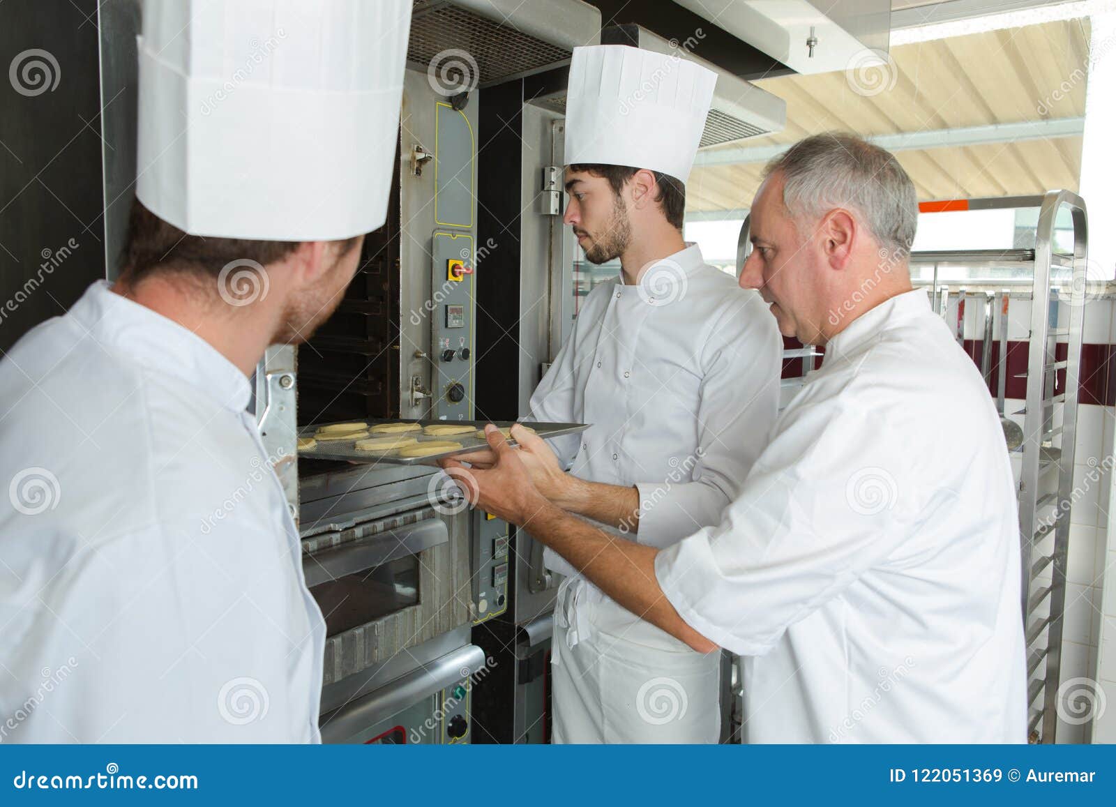 Trainee chef at oven stock image. Image of guidance - 122051369