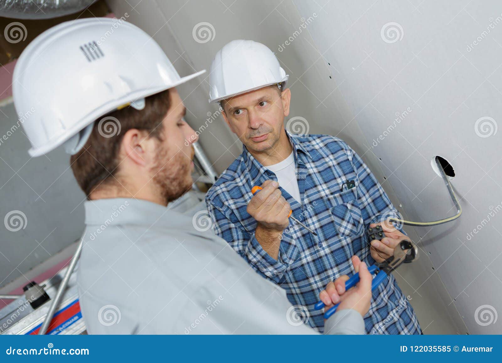Trainee Electrician on Work Site Stock Image - Image of tradesman ...