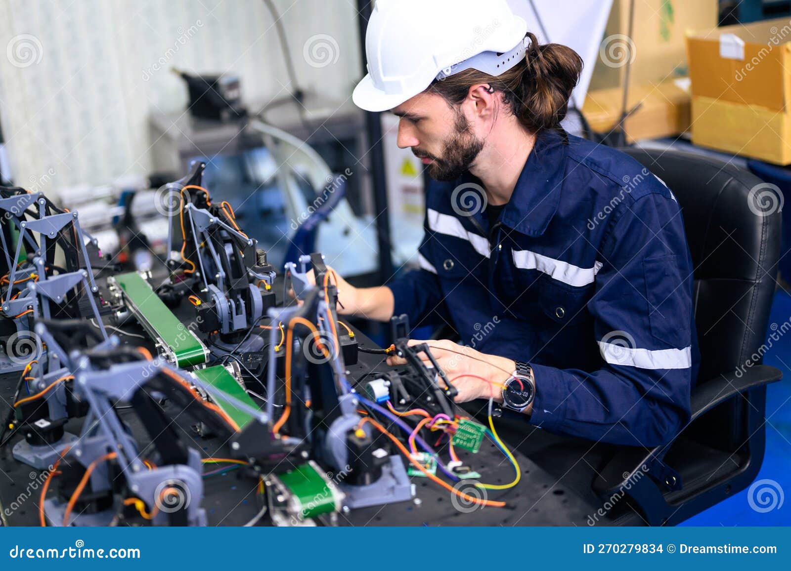 Trainee Engineer Learning and Working in Production Line of Industrial ...