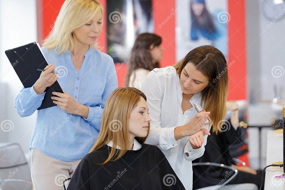 Trainee Hairdresser Offering Client Hair Product Stock Photo - Image of ... Trainee Hairdresser Offering Client Hair Product Stock Photo - Image of ...