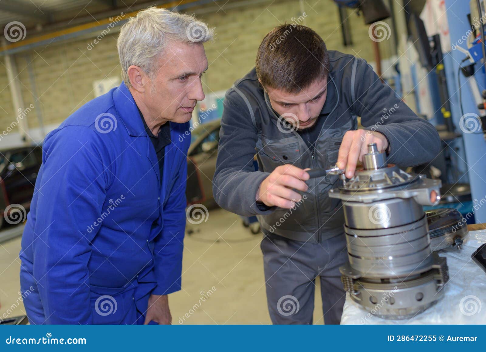 Trainee mechanic at work stock image. Image of training - 286472255